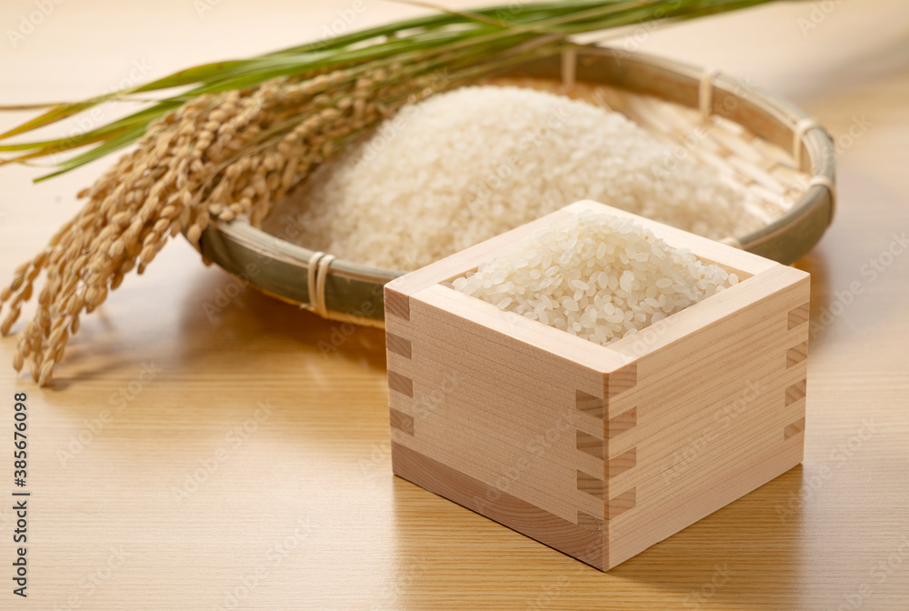 Rice in a Japanese Masu in a wooden background Stock Photo | Adobe Stock