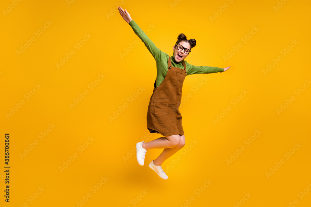 Full length photo of cheerful dreamy girl nerd high school student jump ...