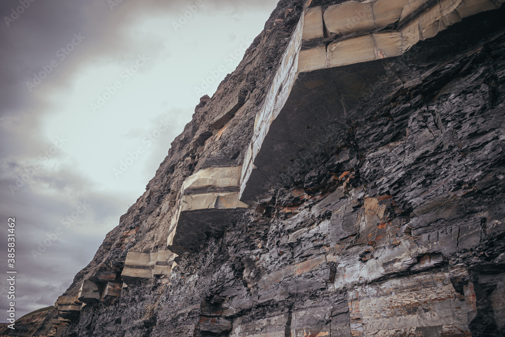 Layered rock of jurassic cliff in Kimmeridge Bay, Devon, prehistoric ...