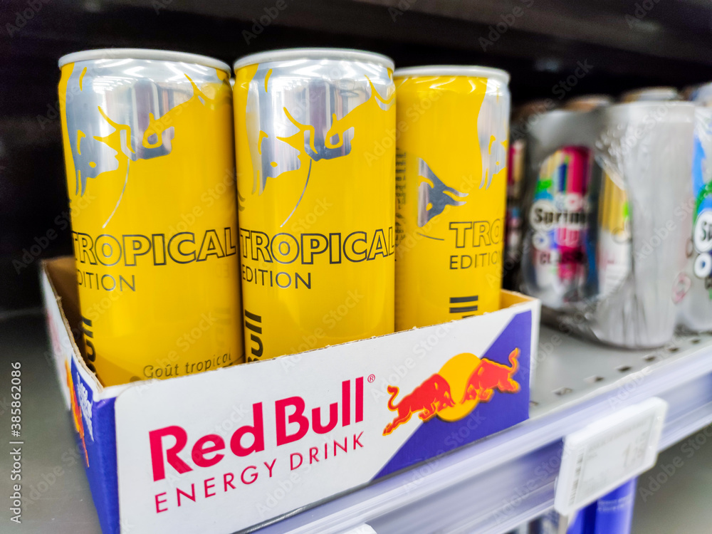 Selected Focus on Cans of Red Bull Energy Drink Tropical edition ...