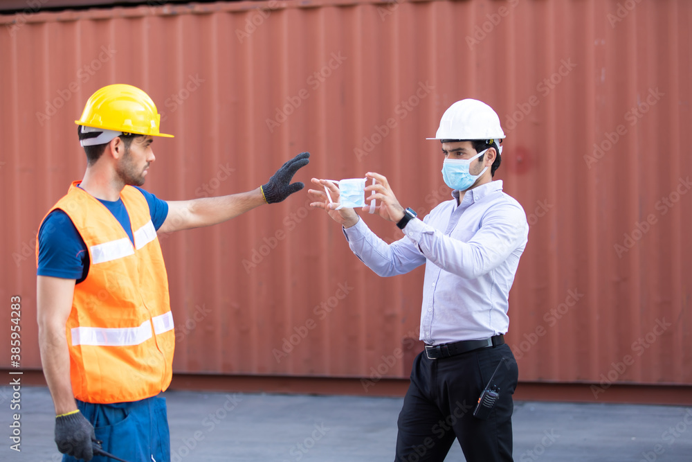 Foreman ask man worker put on face mask protect coronavirus. Man worker ...