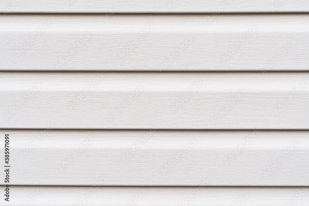 Construction vinyl siding panels pattern. House covered with white ...