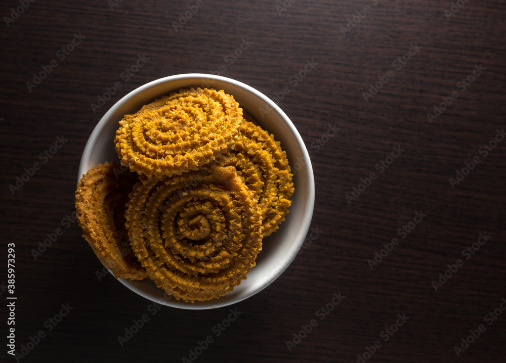 Chakli - an authentic maharashtrian homemade cuisine. A bowl full of ...