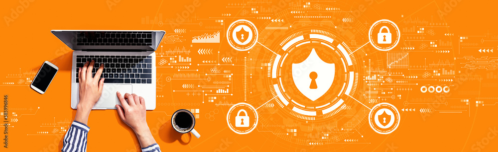 Cyber security theme with person using a laptop computer Stock Photo ...