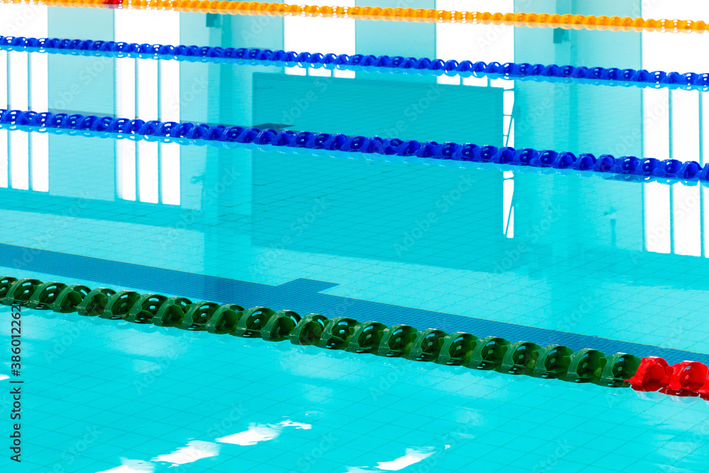 Track & lanes of a competition swimming pool..Indoor swimming pool with ...