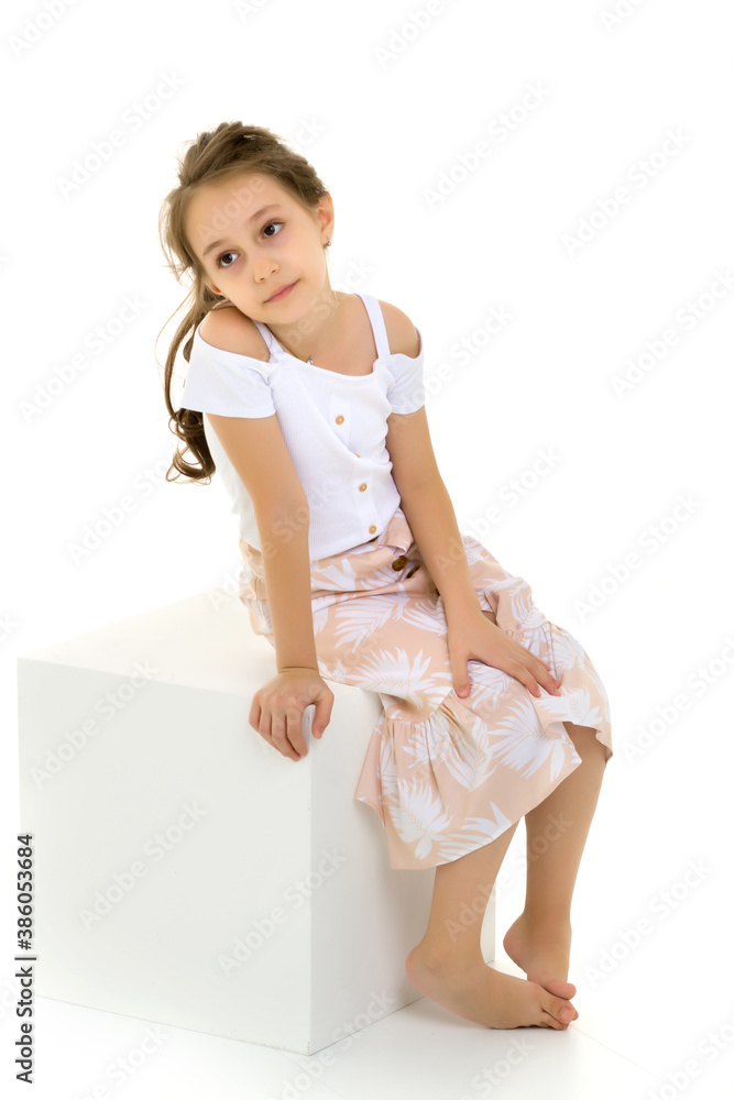 Portrait of Thoughtful Beautiful Girl Sitting on White Cube Stock Photo ... Portrait of Thoughtful Beautiful Girl Sitting on White Cube Stock Photo ...