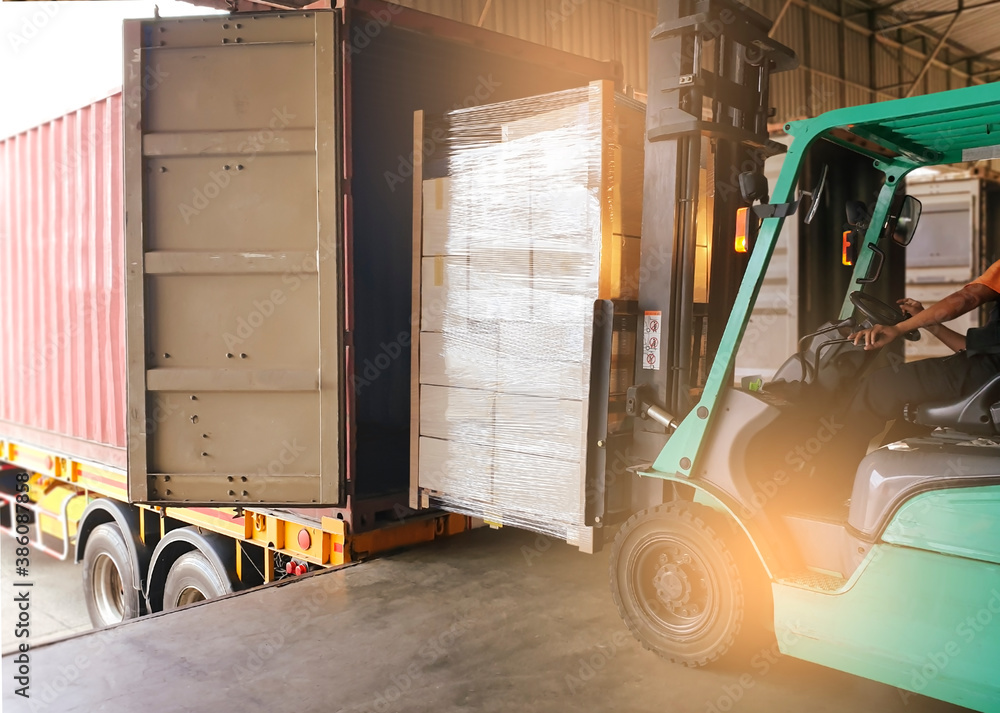 Workers Driving Forklift Tractor Loading Cargo Pallets into Container ...