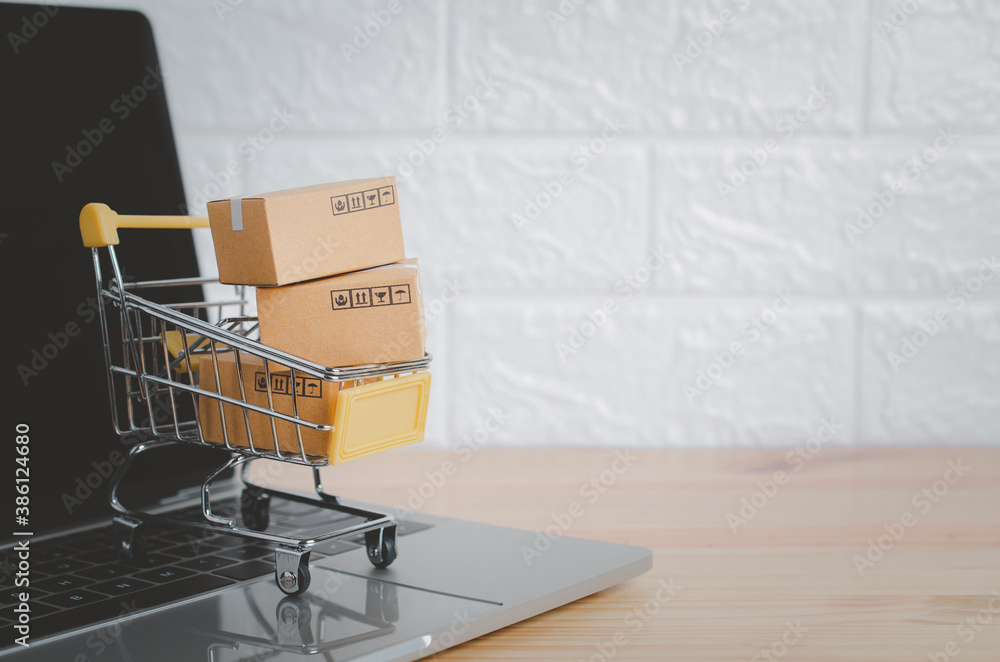 Online shopping and delivery service concept.Brown paper boxs in a ...