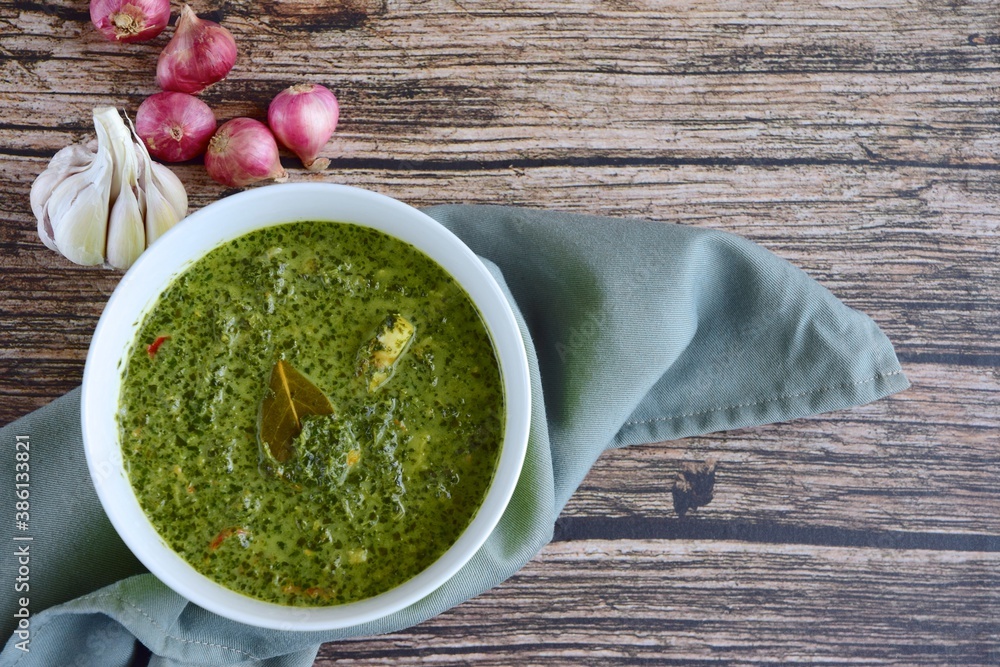 Daun ubi tumbuk or daun singkong or pounded and seasoned cassava leaves ...