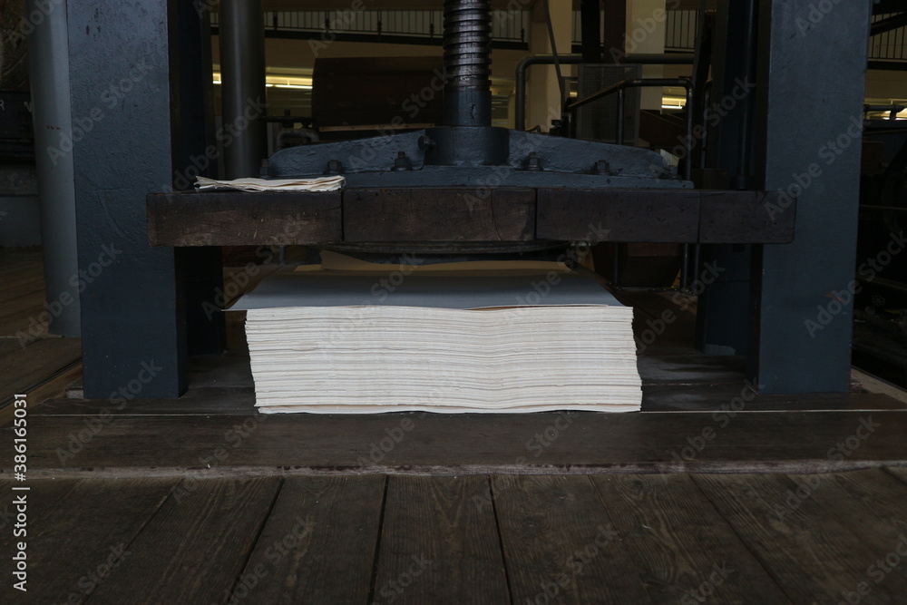 Paper press for dewatering a stack of paper. This kind of press was ...