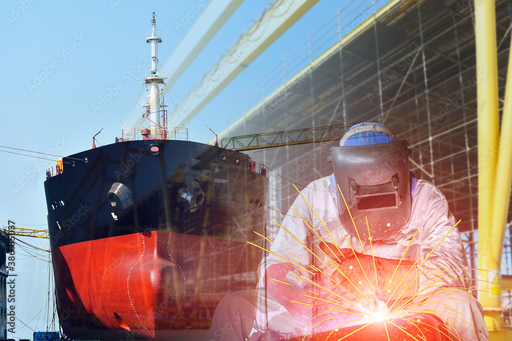 Industrial ship repair and shipbuilding worker welding pipe system ...