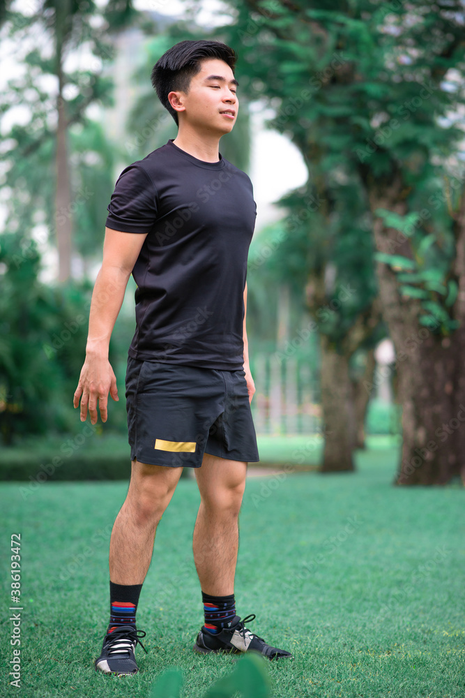 asian guy enjoy take a deep breathe fresh air in the park Stock Photo ...