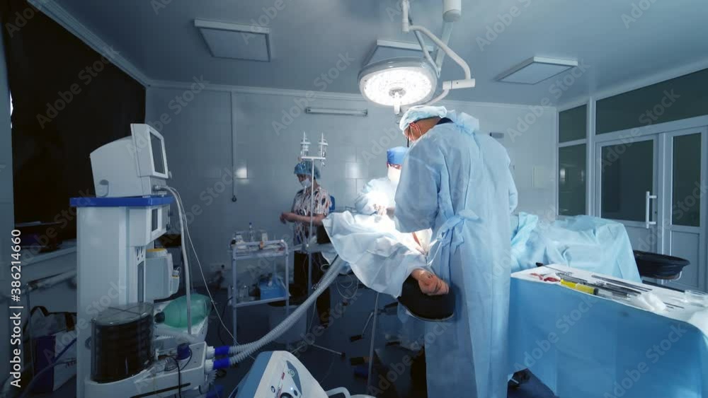 Process of surgery in the operating theater. Group of doctors ...