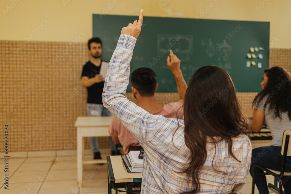 Foto de Latin students in the classroom. back view of female student ...