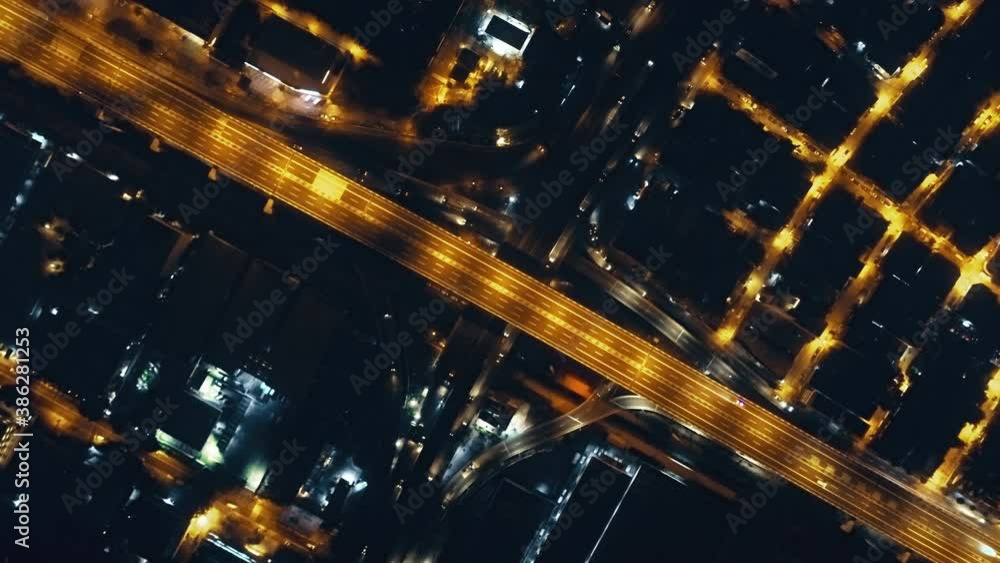 Top down night traffic highway with illuminated city streets aerial ...