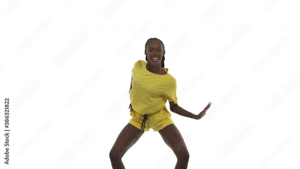 African American woman dancing in afro style. Pushing knee in and out ...