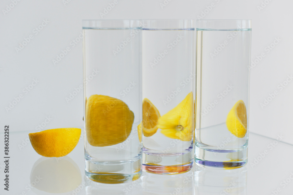 Reflections on glass and water. Art and concept. Lemon reflections ...