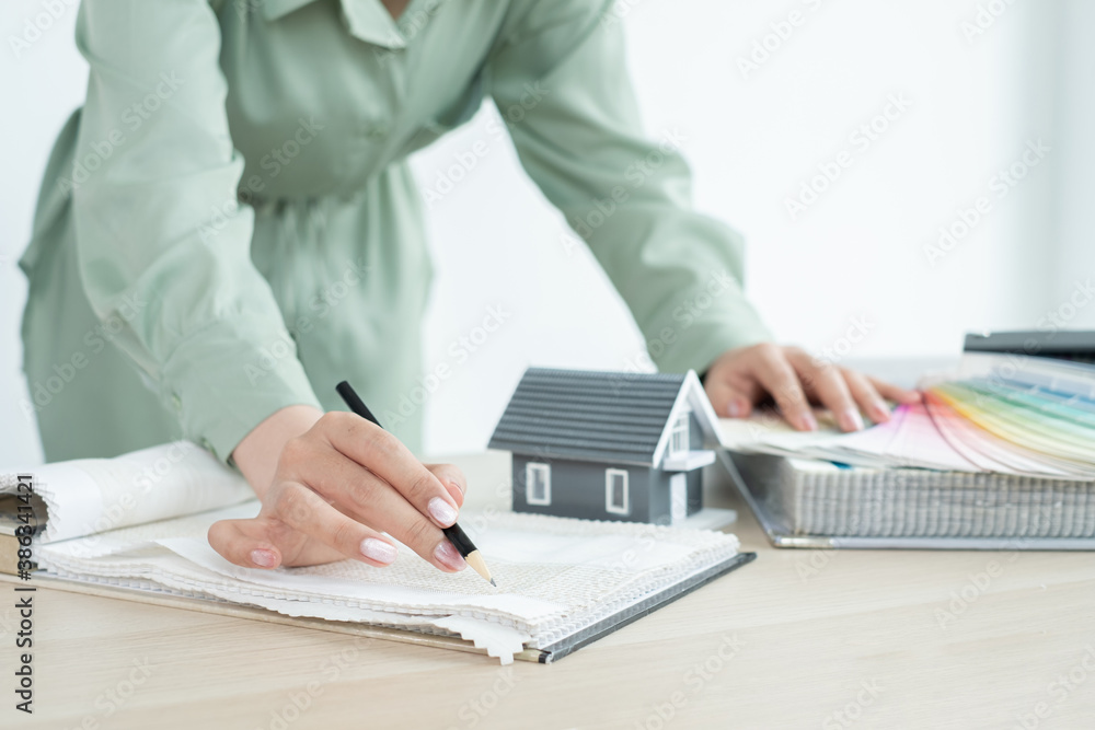 The designer is planning the interior of the house, illustrating and ...