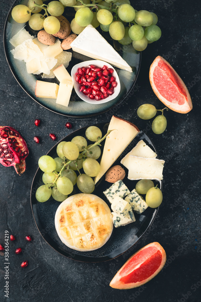 Cheese plate with fatty cheeses and fruits. Bergader Edelpilz, Italian ...