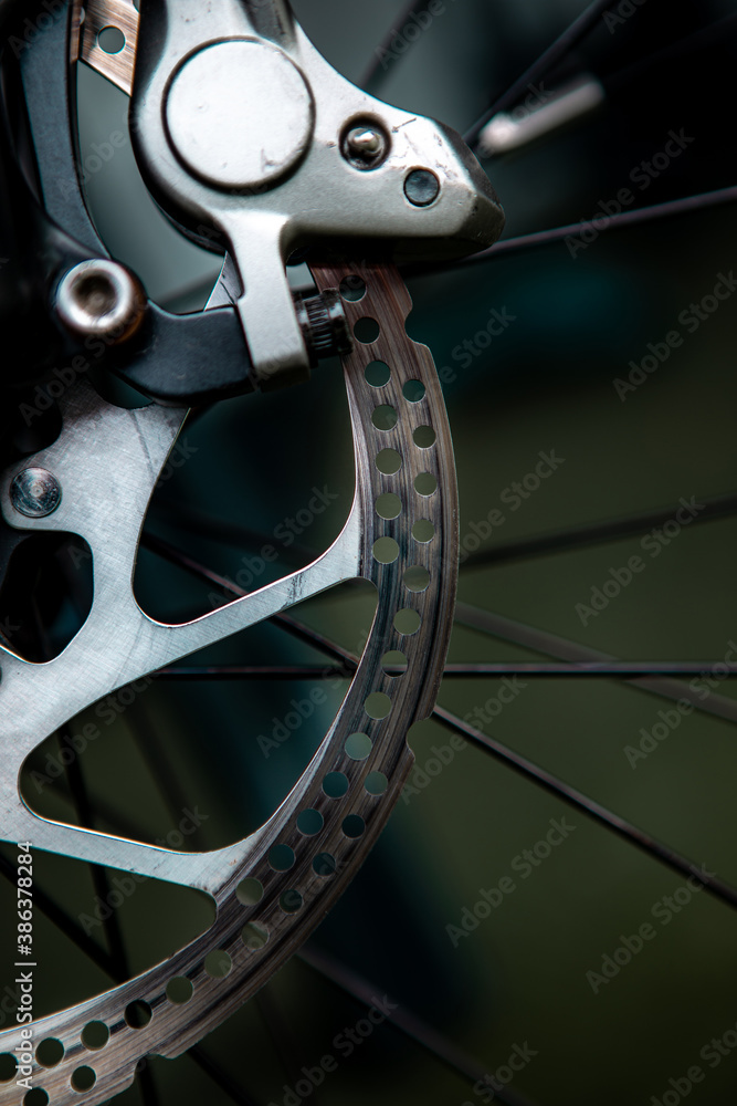 Close-up of a mountain bike brake system. See worn brake disc and ...