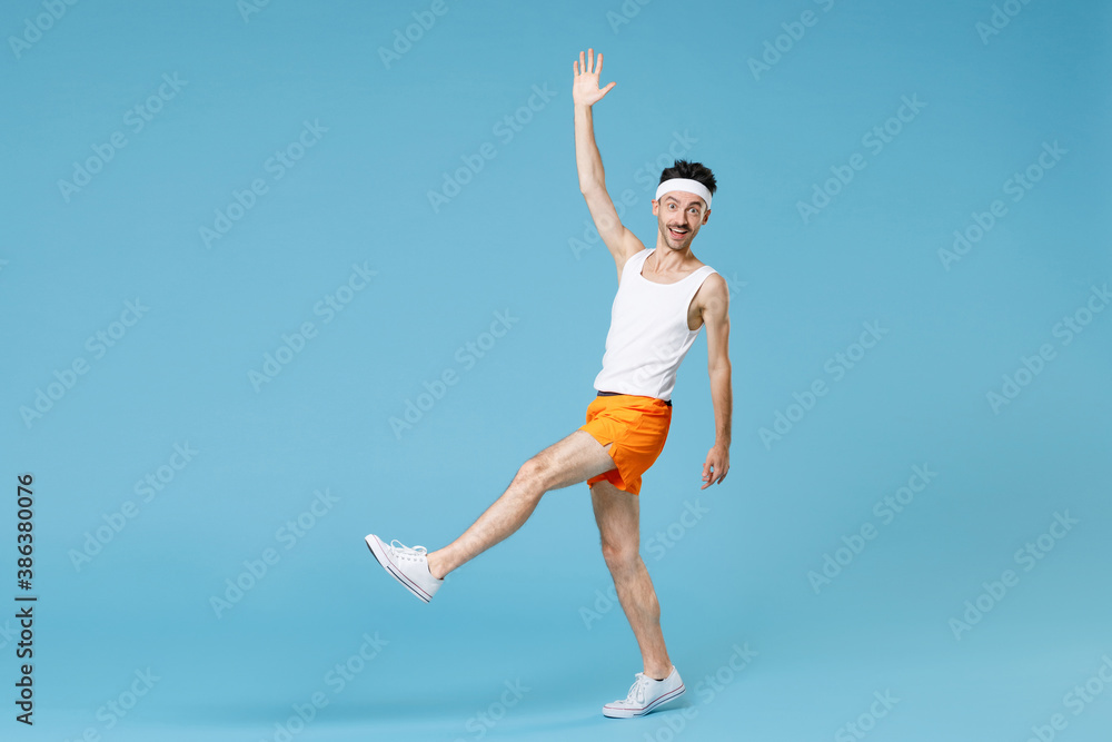 Full length portrait excited young sporty fitness man with skinny body ...