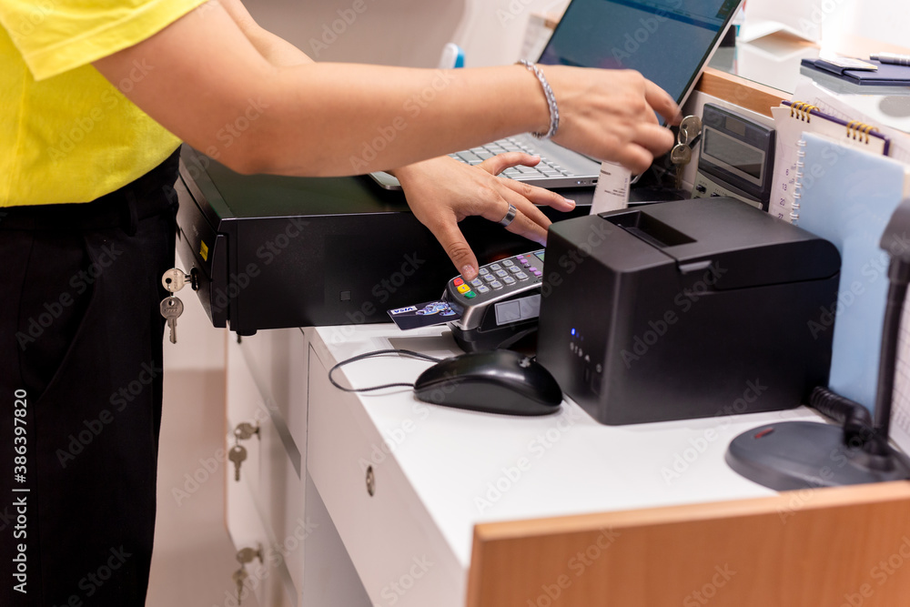 Hand taking receipt from credit card reader at counter service. Stock ...