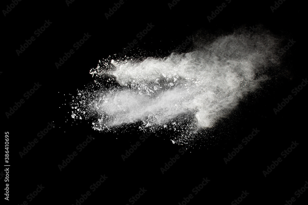 White powder explosion cloud against black background.White dust ...