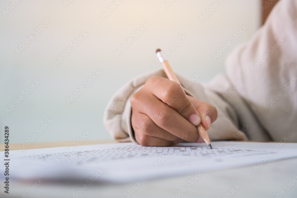 Hands Student testing in exam on exercise sheet, taking at school or ...