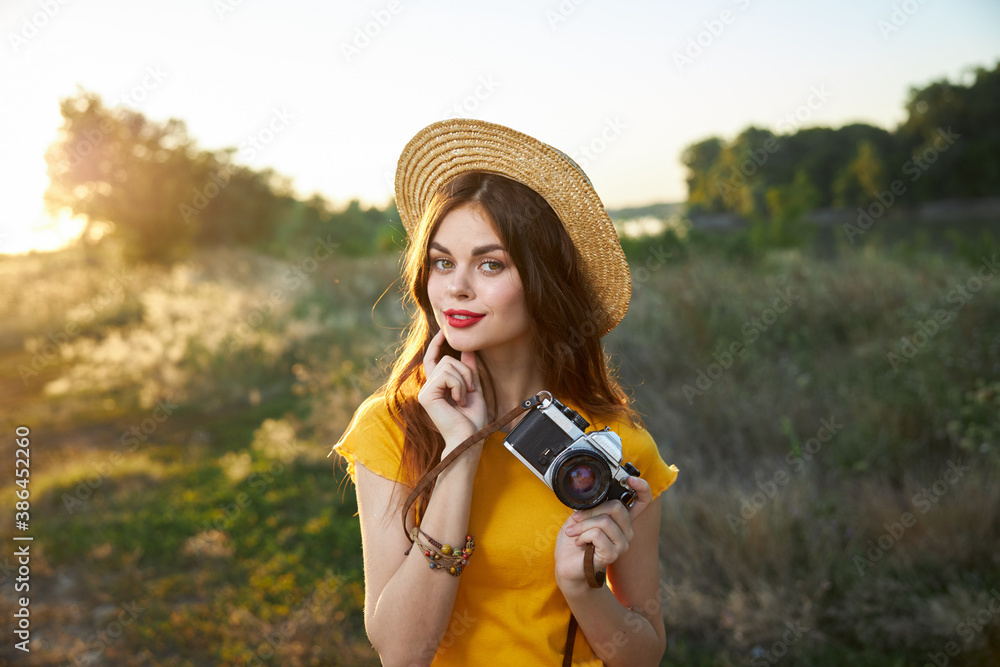 pretty woman holding a camera attractive look red lips hat nature Stock ...