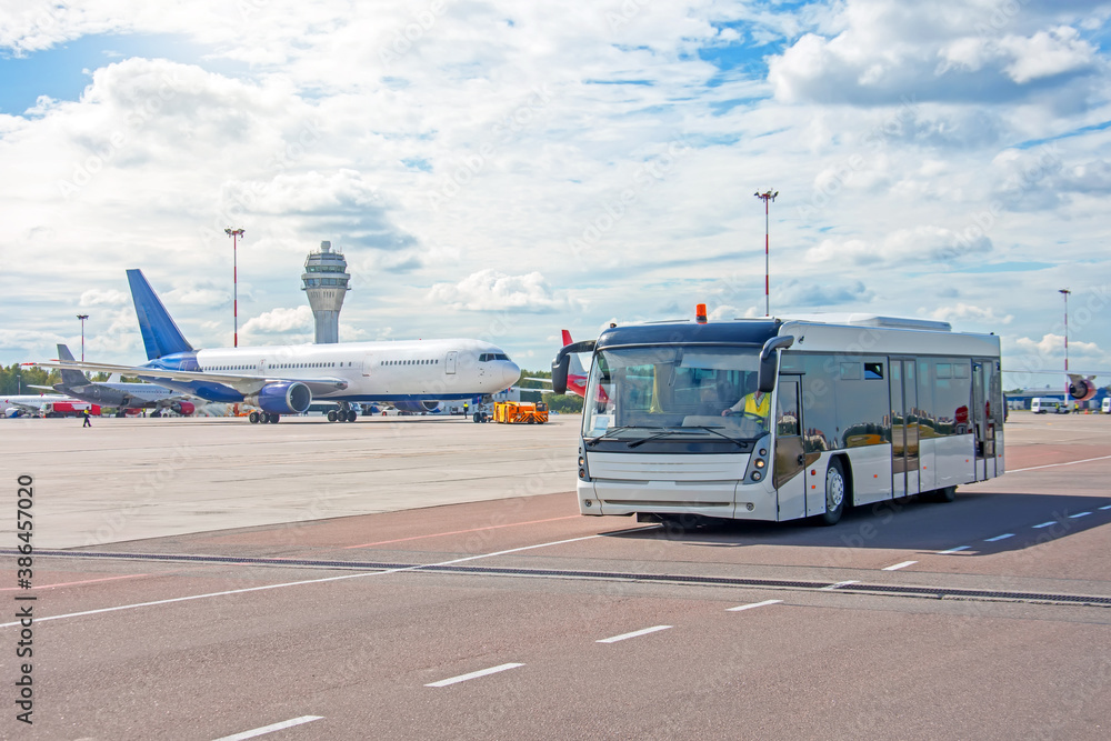 Bus for transporting passengers to boarding aircraft, against the ...