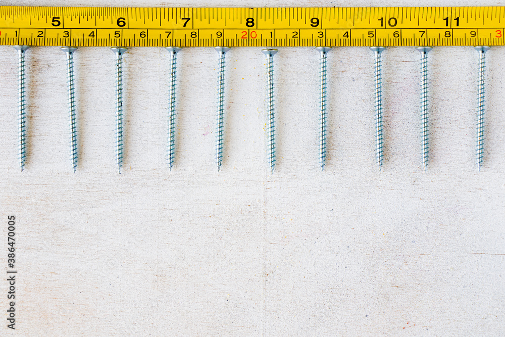 Metal ruler and scows, centimeters and millimeters on the yellow ruler ...