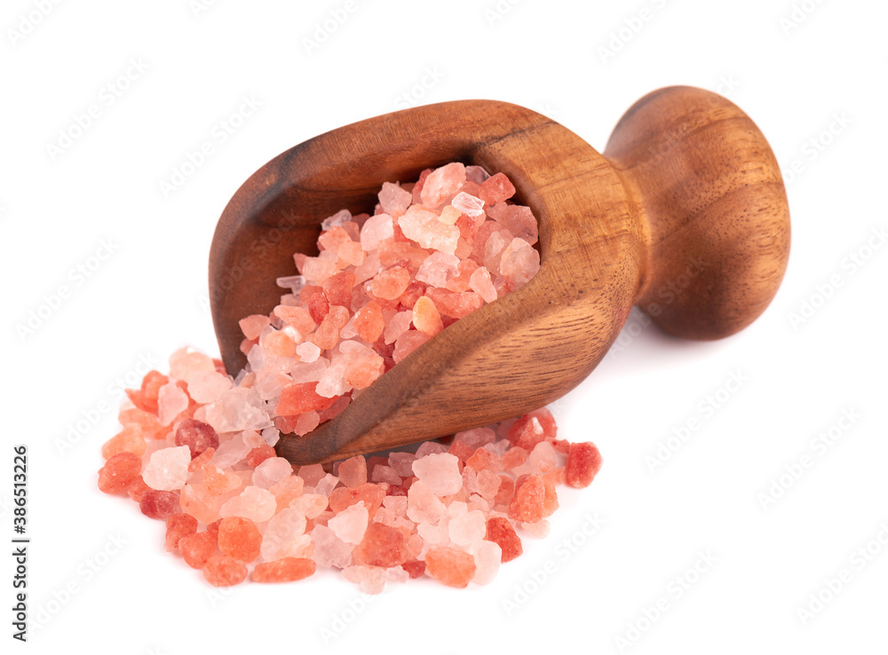 Himalayan pink salt in wooden scoop, isolated on white background ...