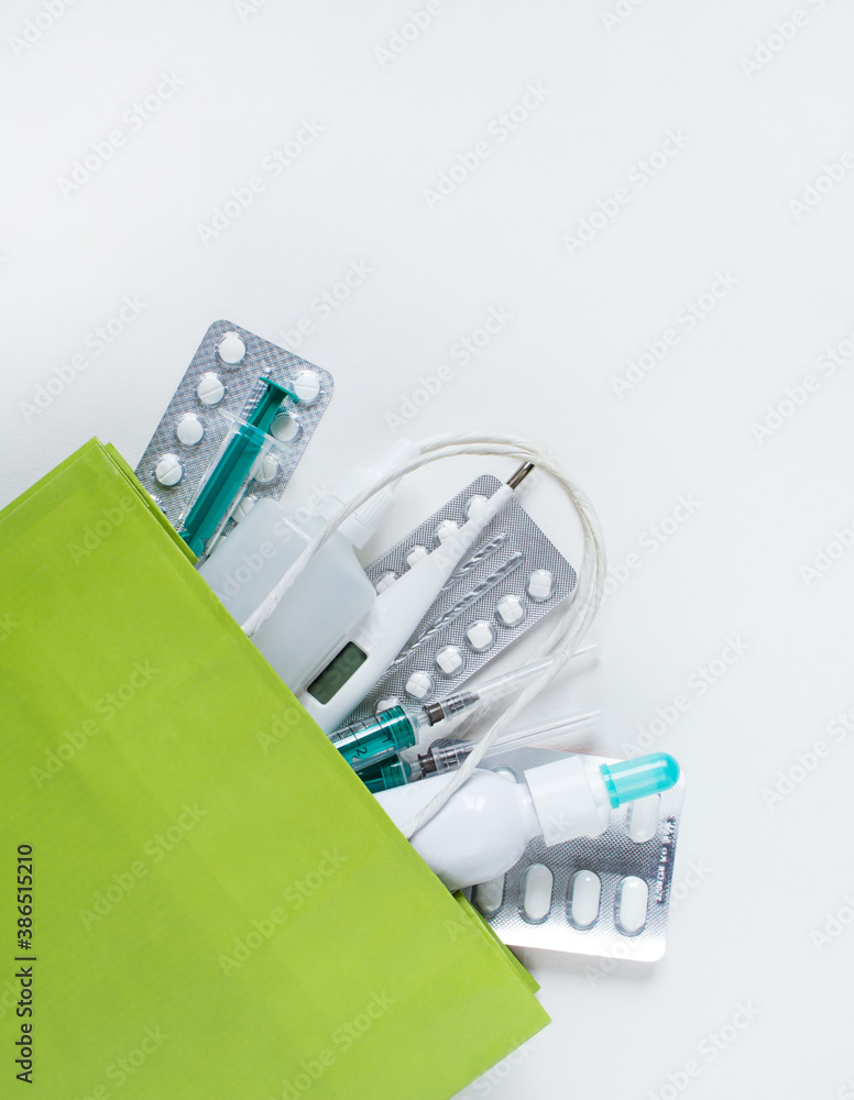 package with medicines, tablets, sprays, thermometer, syringes. Drug ...