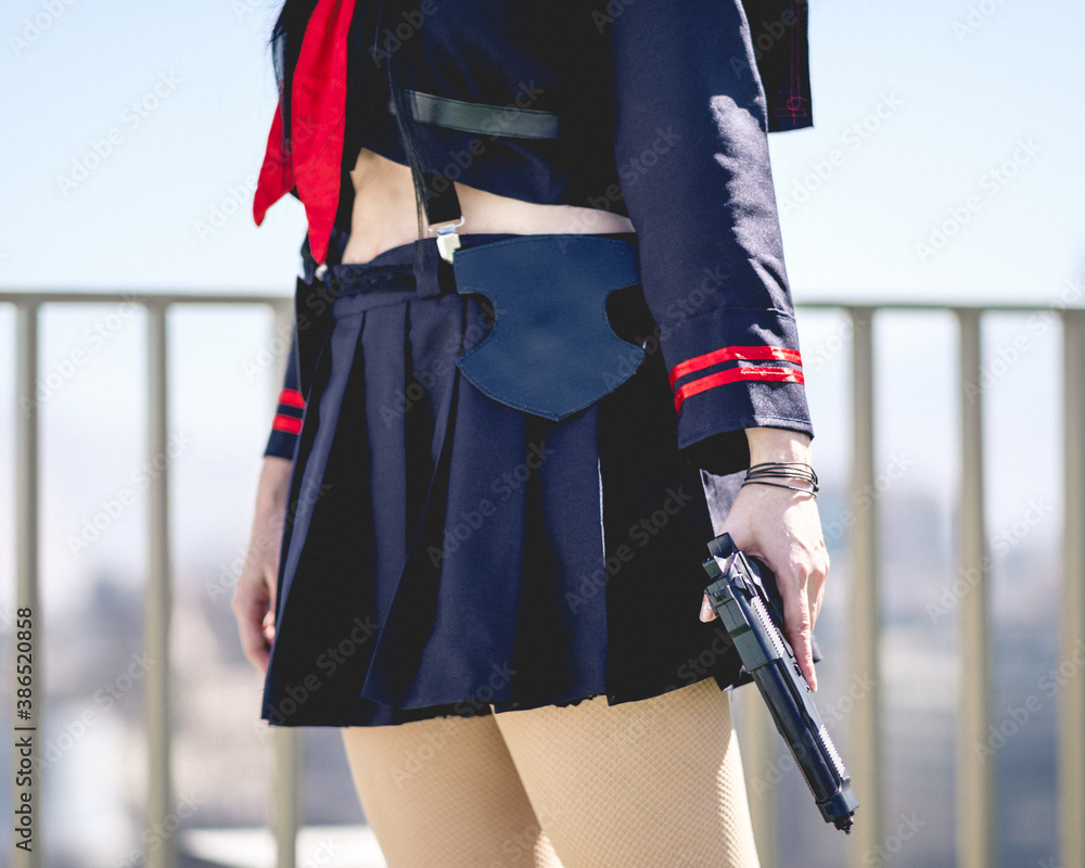 Girl With Anime Cosplay Costume And A Gun Similar To A Police Officer