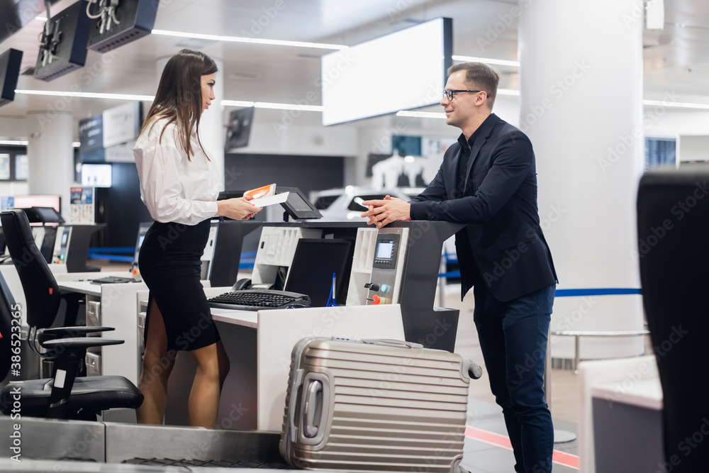 Business trip. Handsome young businessman in suit holding his passport ...