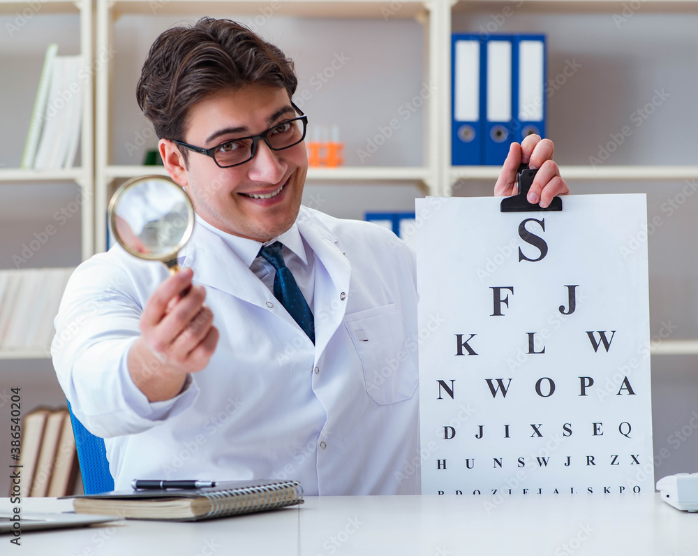 Doctor optician with letter chart conducting an eye test check Stock ...