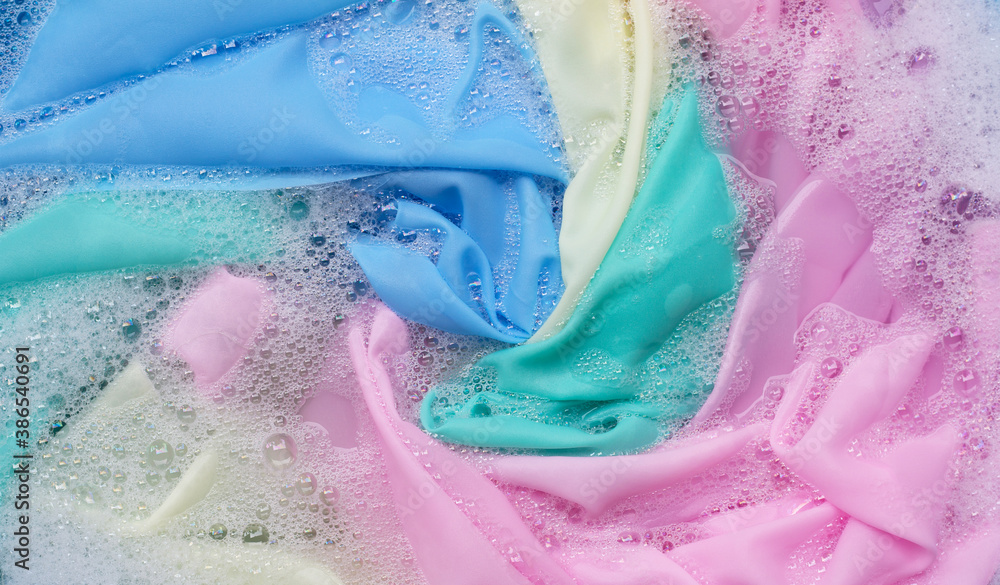 Color clothes soak in powder detergent water dissolution. Laundry ...
