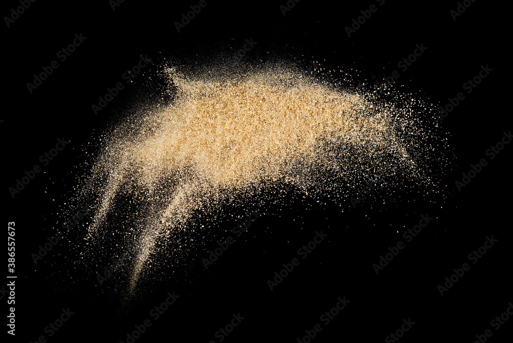 Sand splash explosion isolated on black background ,throwing freeze ...