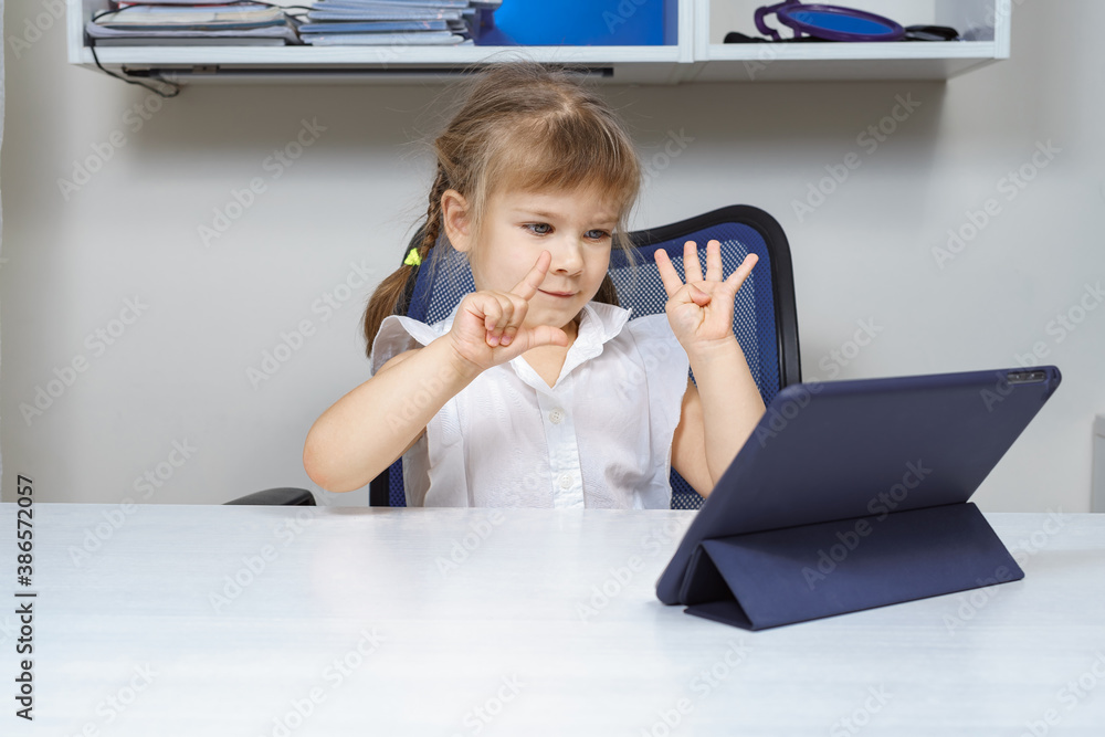 method of teaching quick mental math with fingers. little girl doing ...