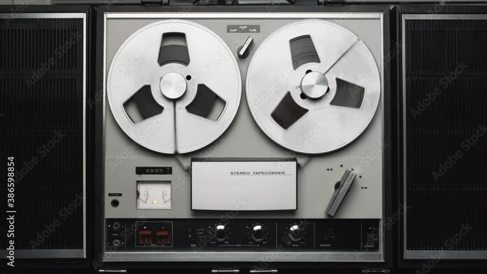 Music player vintage close up. Tape reels rotating of retro tape ...