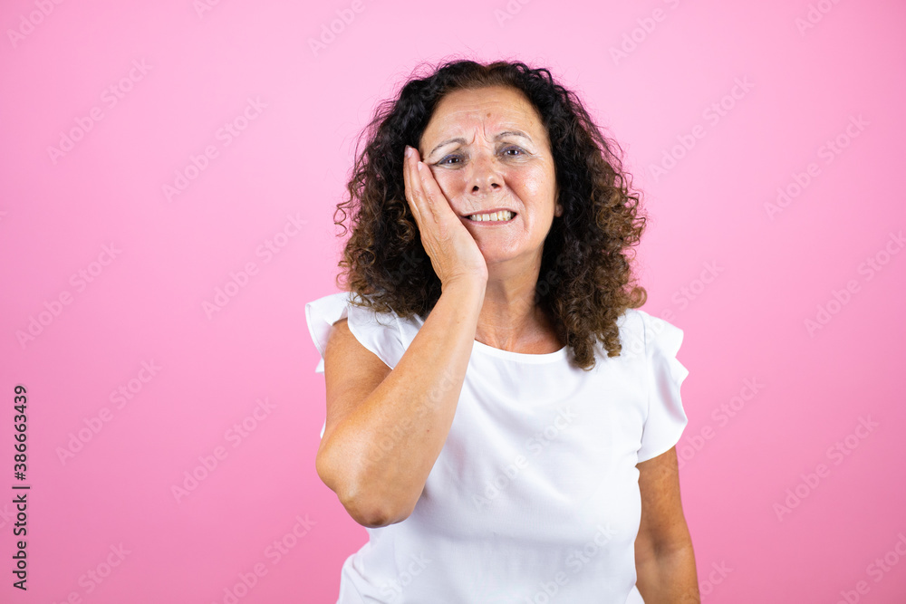 Middle Age Woman Wearing Casual White Shirt Standing Over Isolated Pink