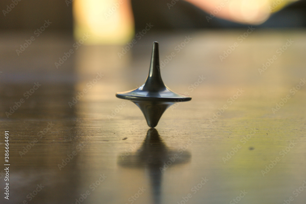 Steel metal inception spinner on table Stock Photo | Adobe Stock