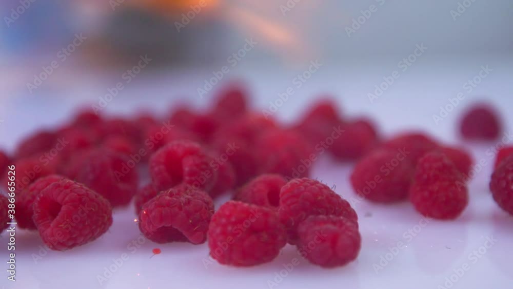 Raspberry and fire. Raspberry is burning with fire in slow motion ...
