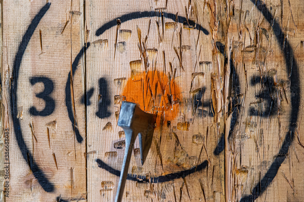 Axe throwing target with axe in center on bullseye Stock Photo | Adobe ...