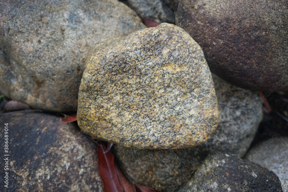 Granite rock on nature background. Granite is a light-colored igneous ...