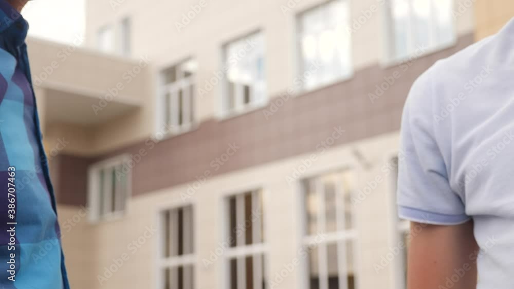 two businessmen touch elbows social distance. bump avoid greeting ...