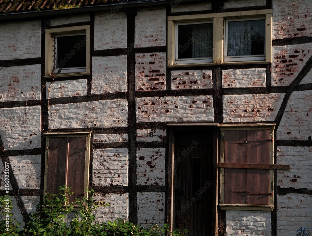 Details of a half-timbered house in need of renovation , over the ...