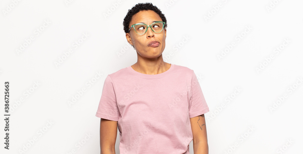 afro young black woman looking goofy and funny with a silly cross-eyed ...