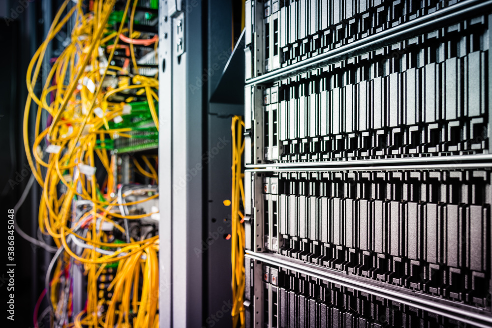 Server rack with fiber optic cables attached to switch Stock Photo ...