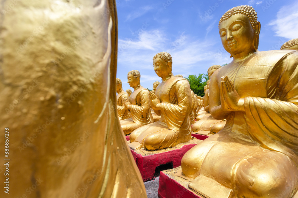 Golden Buddha with 1250 disciples statue at Makha Bucha Buddhist ...